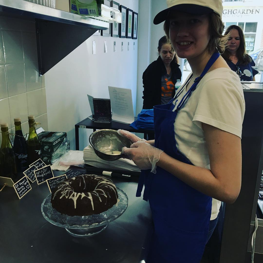 Employee Frosting Cake | No Label at The Table Food Company